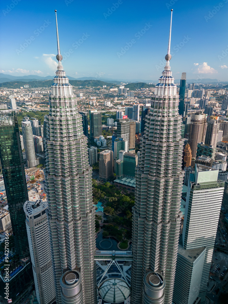 An aerial view showcasing the Petronas Twin Towers situated in a ...