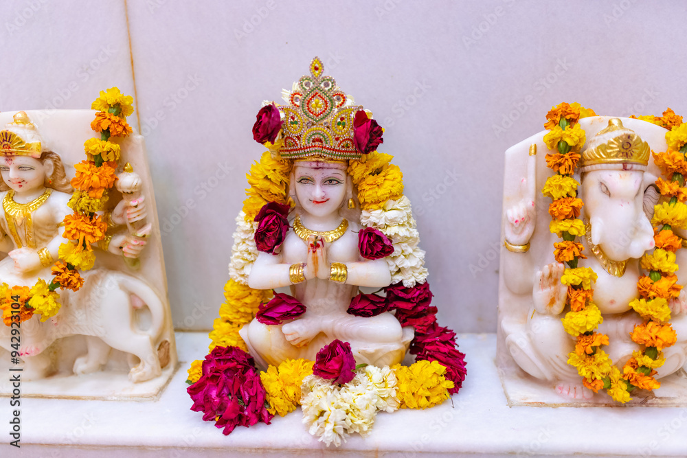 Idol of goddess parvati decorated with rose and marigold flower at ...