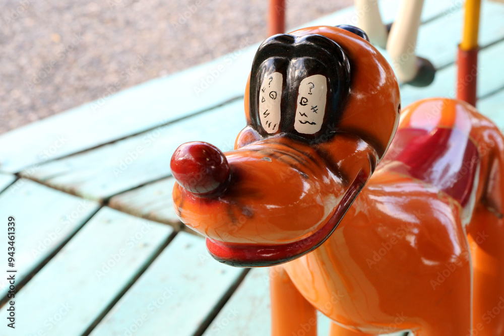 Carousel. Old carousel for children with a figure of Disney's Pluto dog ...