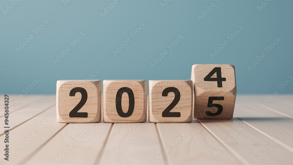 Wooden blocks on a light wooden surface display the numbers "2024." The ...
