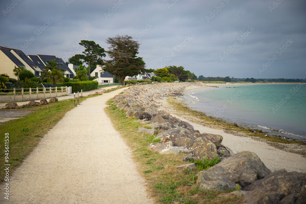 Path along Grand Plage beach in the charming village of Ile-Tudy ...