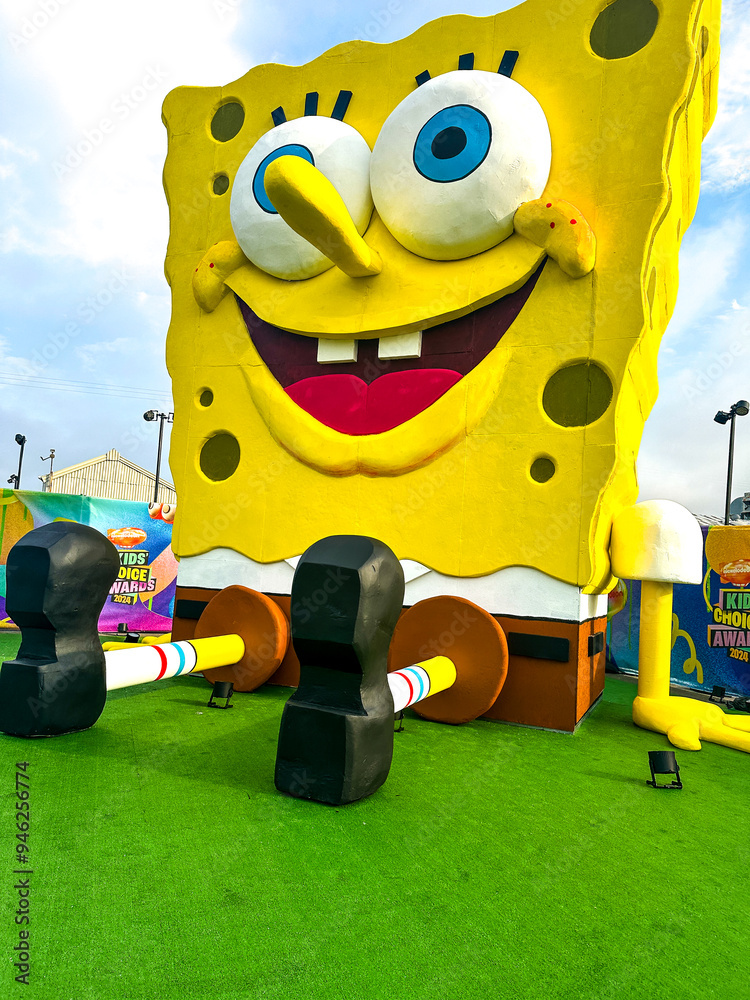 Giant SpongeBob Squarepants blowup ballon sitting down outside Stock ...