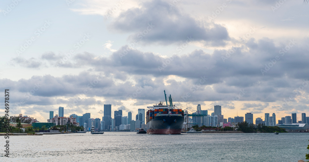 Cargo ship leaving harbor. Cargo business. Container ship. Shipping ...
