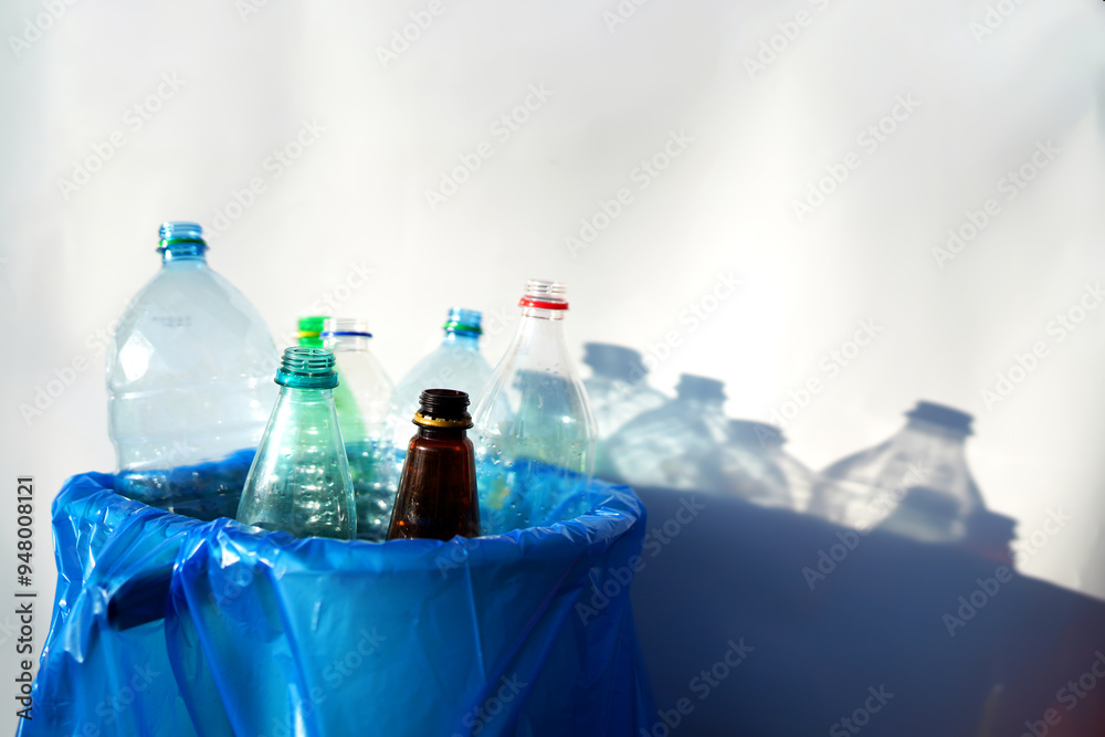 Plastic sorting for Recycling. Empty plastic bottles in trash bin ...
