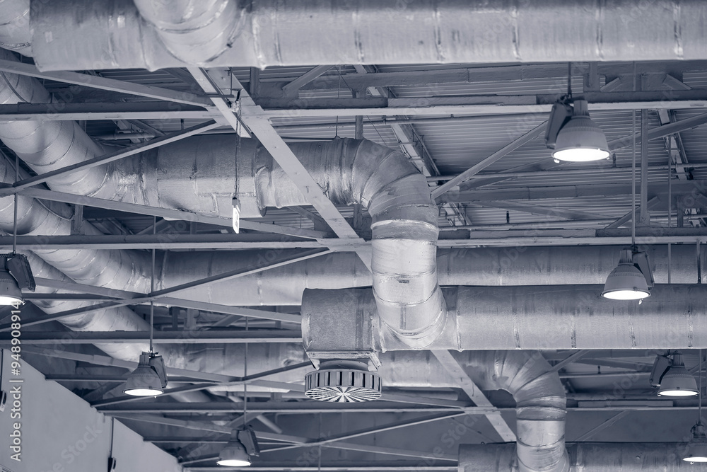 Ventilation system in shopping mall, pipes hvac duct tube hanging from ...
