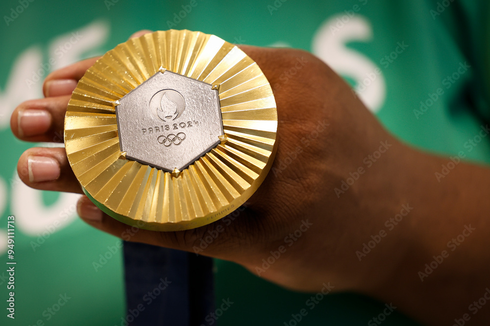 Gold medal of Paris 2024 Olympic Games handheld. Detail shot of Summer ...