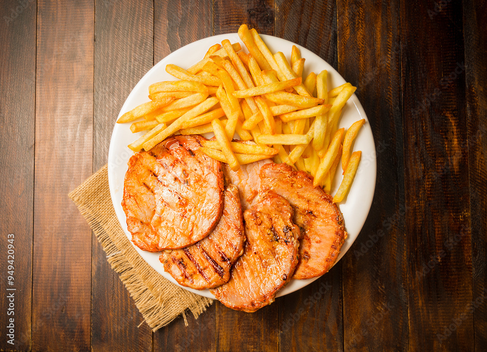 Filetes de lomo con patatas fritas Stock Photo | Adobe Stock