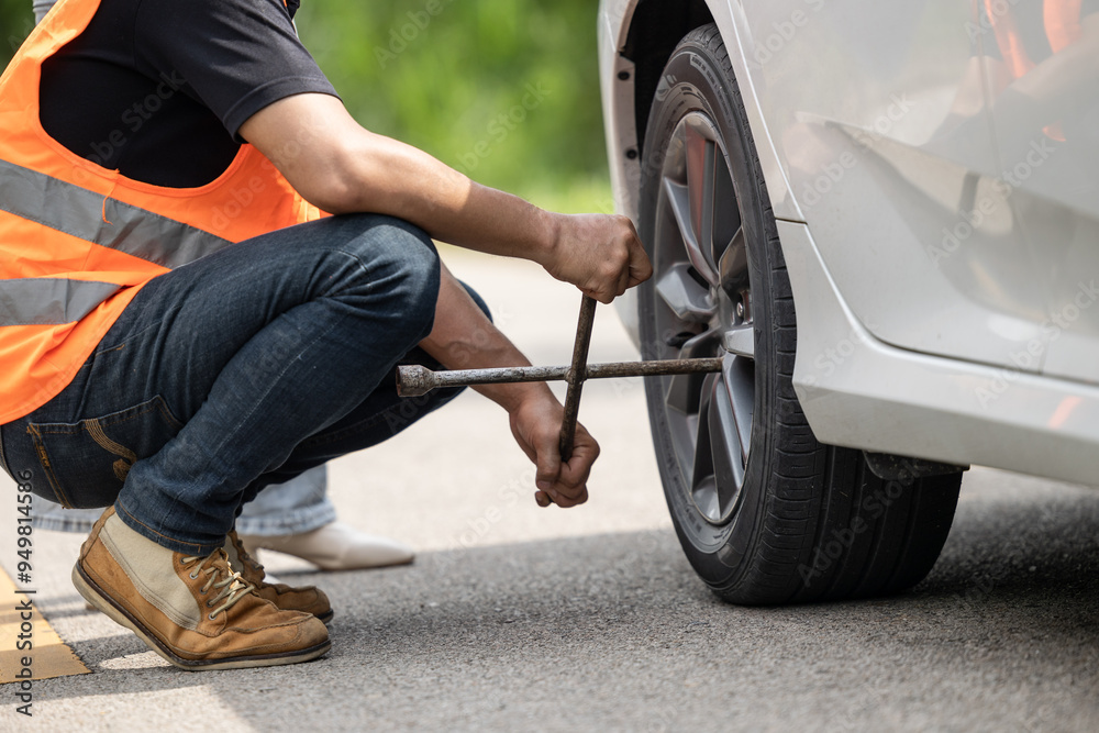 Mechanic team working road assistant help to replace flat tire service ...