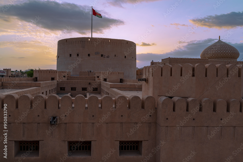 The historic Nizwa Castle in the Sultanate of Oman is one of the most ...