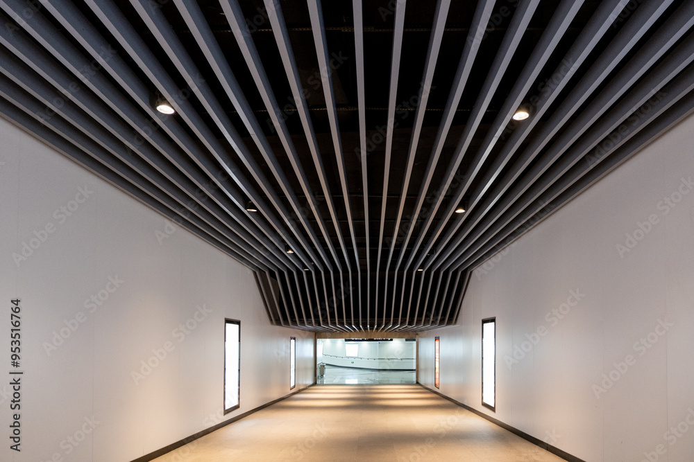 A modern and minimalist interior design of a long hallway or ...