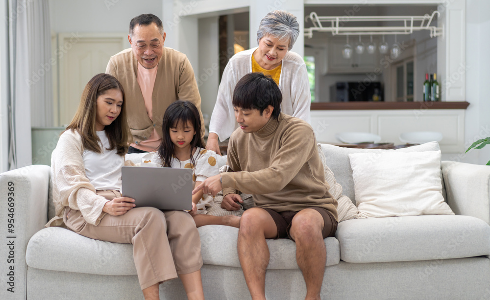 Father and mother with asian kid girl learn on laptop computer ...