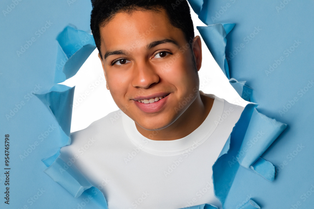 Guy peeks out of blue from behind some paper. texture rip crumpled ...