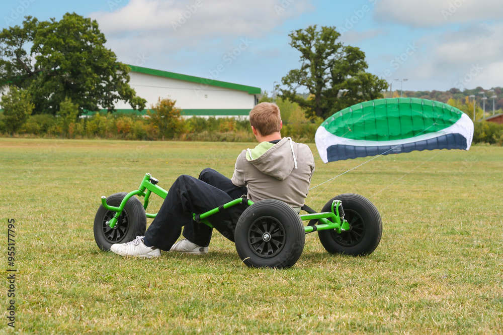 Extreme sports, kite buggy riding, young man prepares to launch ...