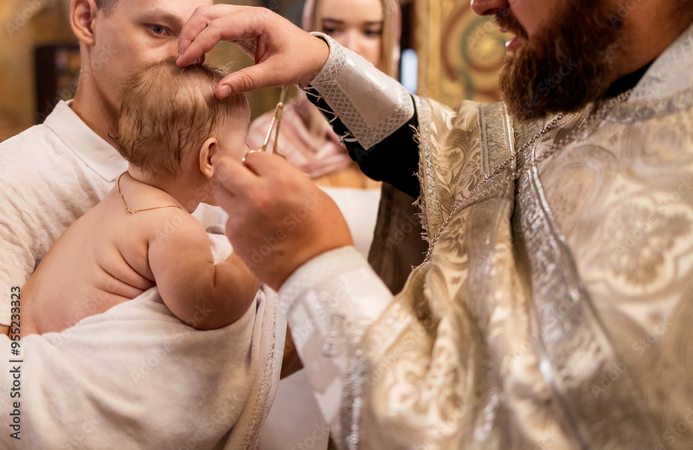 Newborn baby baptism in Holy water. Infant bathe in water. Baptism in the font. Sacrament of ...