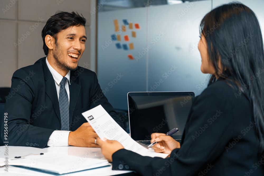 Human resource manager interviewing the male employment candidate in ...