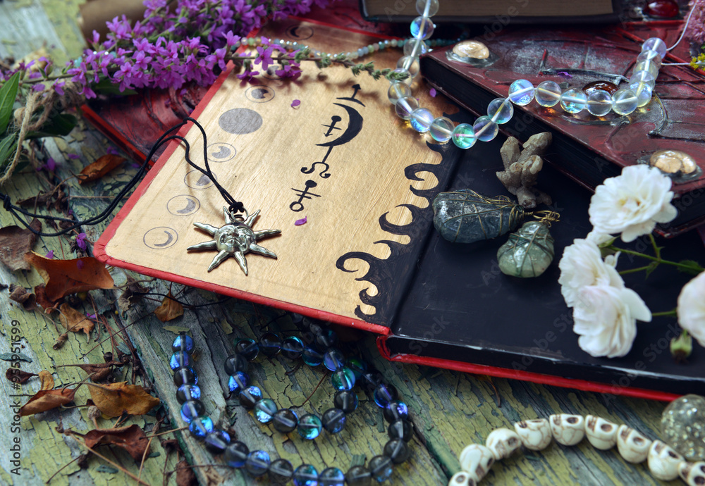 Mystic still life with magic book of spells, amulet and witchy ritual ...