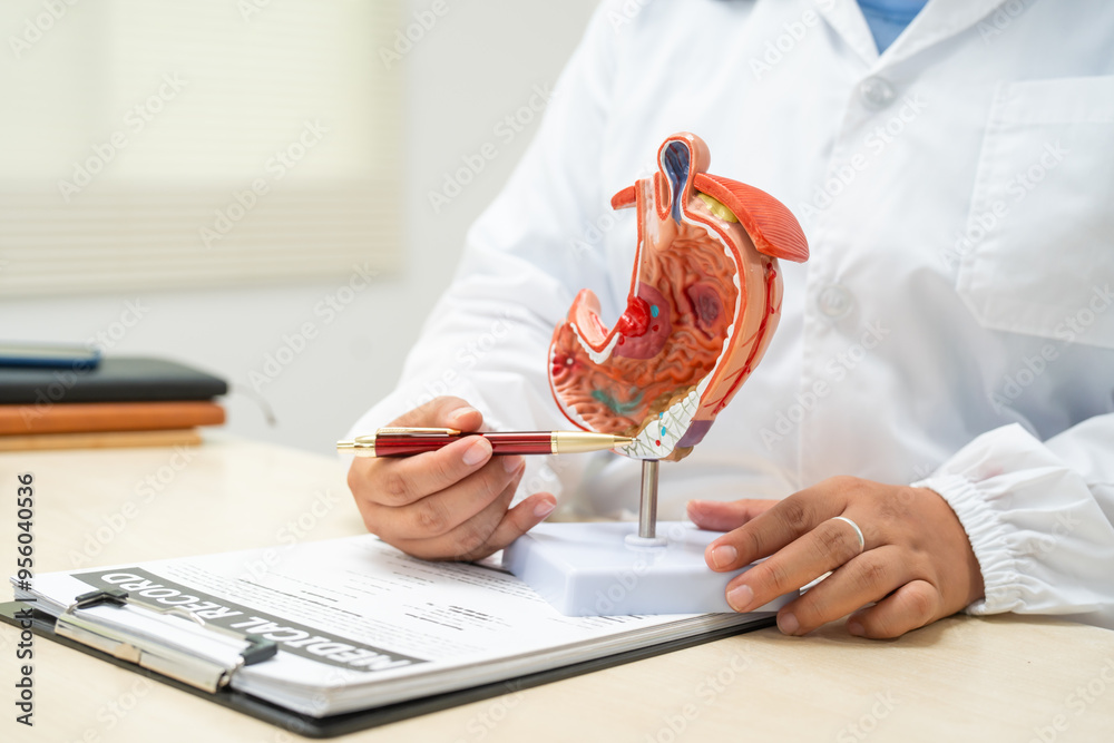 A female doctor a hospital desk discussing digestive disorders such as ...