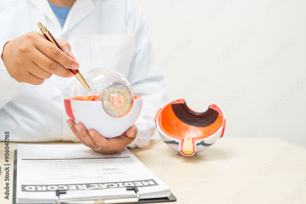 A female doctor at a desk in a hospital, discussing eye diseases such ...