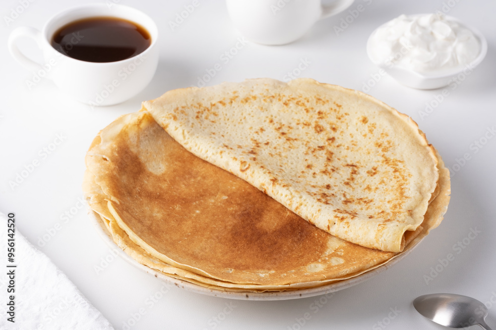 Stack of traditional russian pancakes blini on white background ...