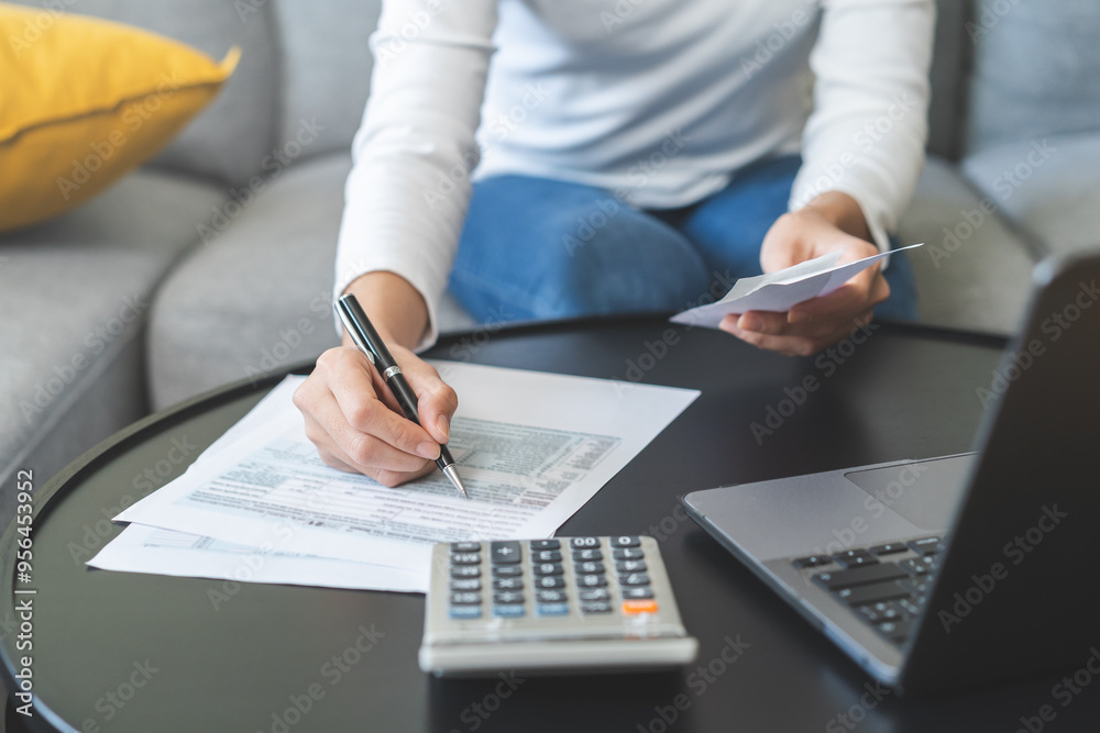 Deduction planning concept. Asian young woman hand using calculator to ...