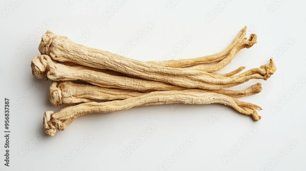Cluster of dried ginseng roots isolated on a white background ...
