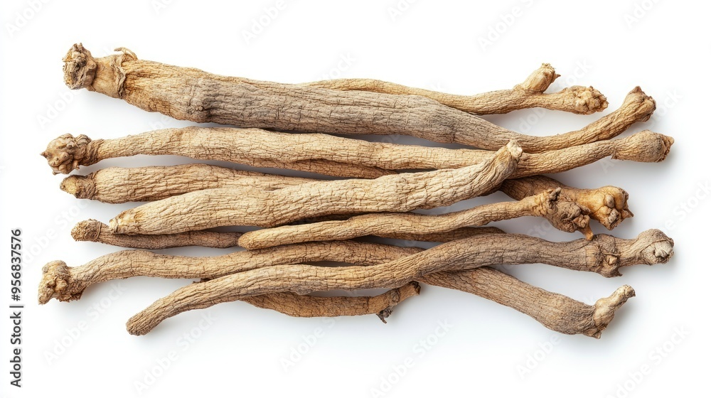 Cluster of dried ginseng roots isolated on a white background ...