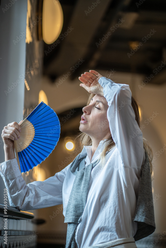 Female, tired of stuffiness at work, suffering from heat or headache ...