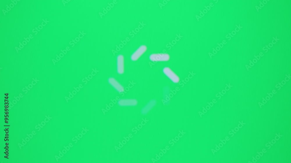 Green Background Loading Animation, with white pill-like segments rotating in a circular pattern ...