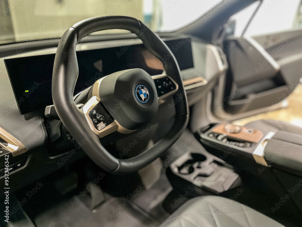 BMW iX 40 Steering wheel and dashboard. BMW iX is a battery-electric ...