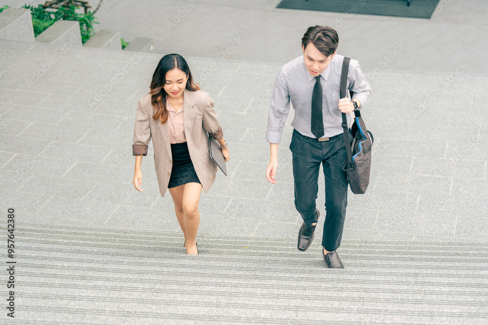Asian team business man ans woman walking to work diligently and ...