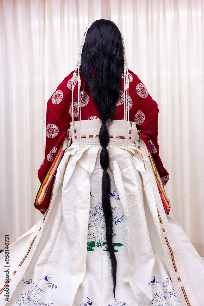Japanese woman wearing the jūnihitoe (twelve-layer robe). The ...