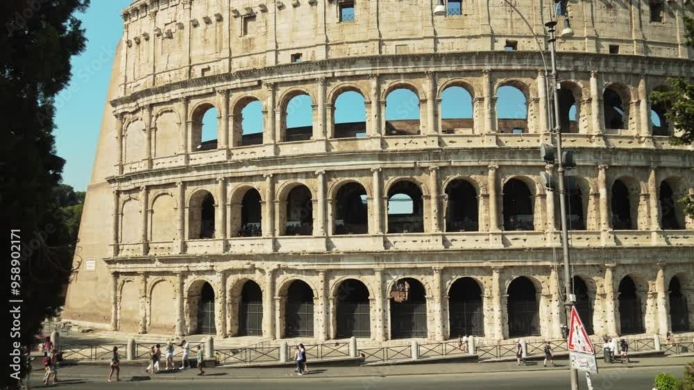 Crowd of tourists strolls near the Roman Coliseum or Flavian ...