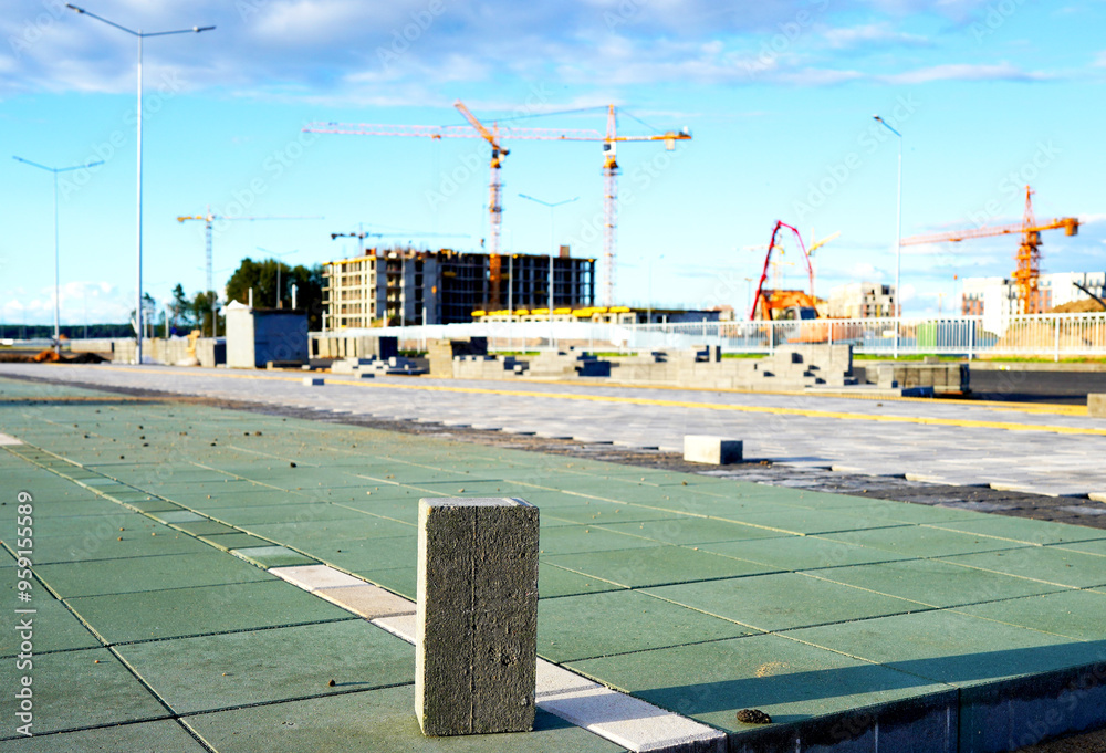 Sidewalk Tiles Laying. Laying Paving Slabs on construction site. Stone ...