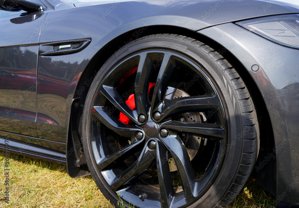 Alloy wheel with calipers and racing brakes of the sport car. Racing ...
