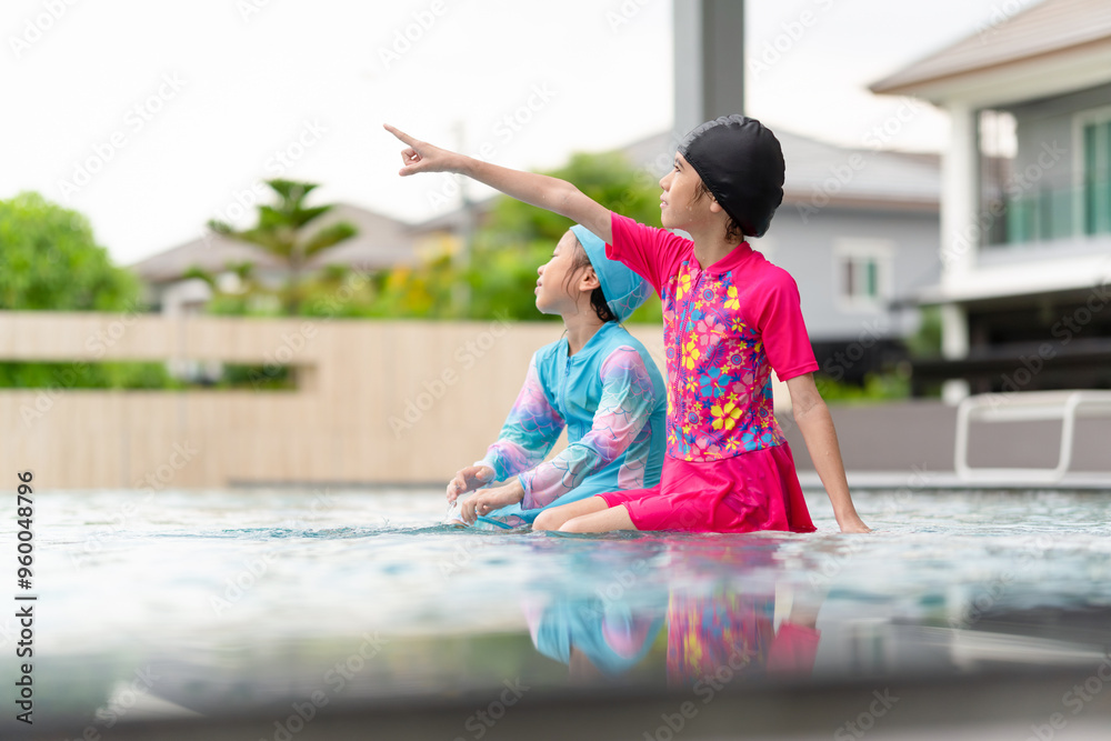 Asian kids girl playing and having fun in swimming pool, Asian children ...