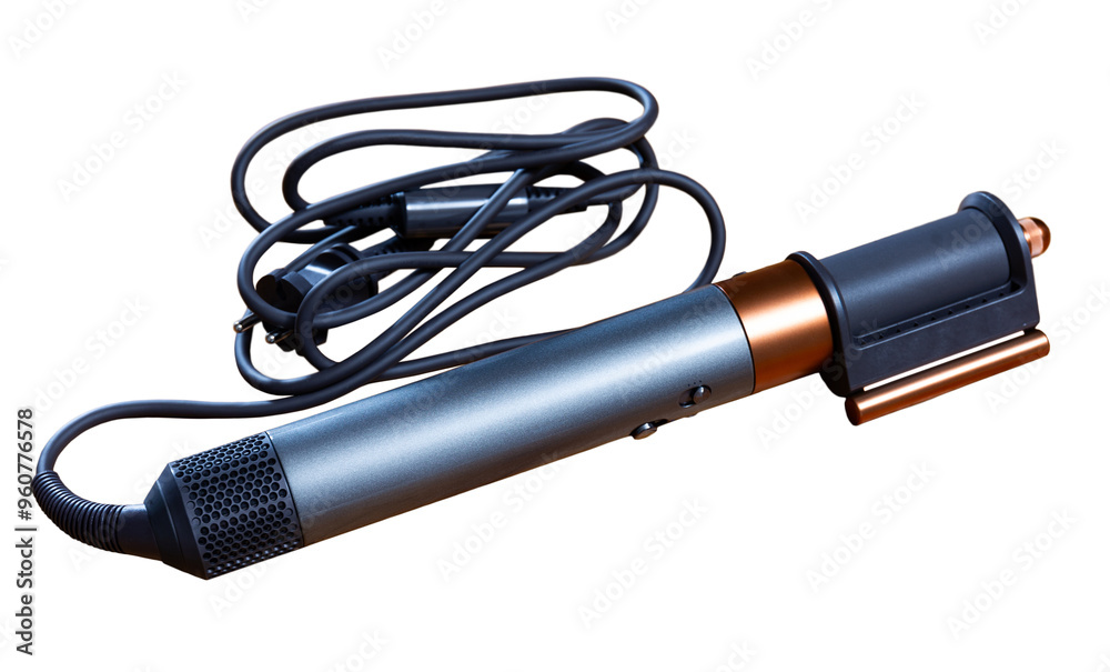 On wooden table there is branded device for creating hairstyles and ...