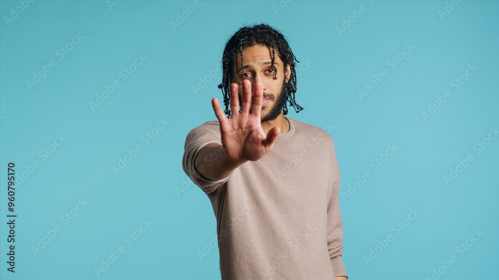 Assertive Middle Eastern man asking for timeout, doing hand gestures ...