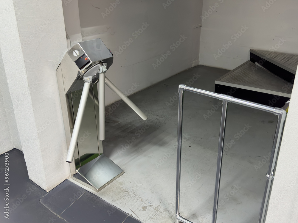 Entrance with turntables. A checkpoint with a turnstile. Turnstile with ...