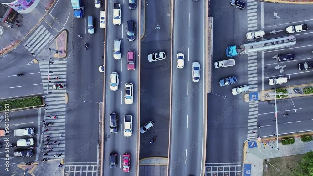 Ascending overhead shot moving away from a busy intersection, revealing ...