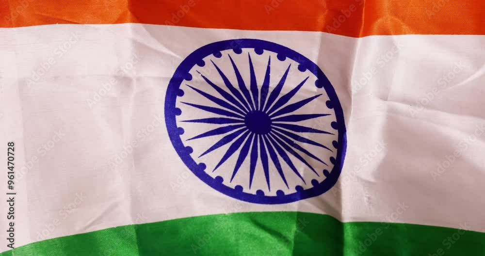 A detailed view of the Indian national flag fluttering in the wind. The ...