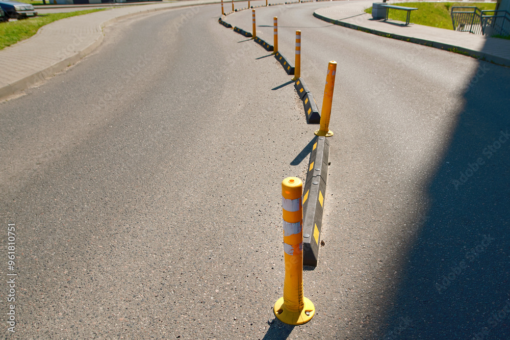 Yellow traffic cones on an urban roadway. Lane dividers and safety ...