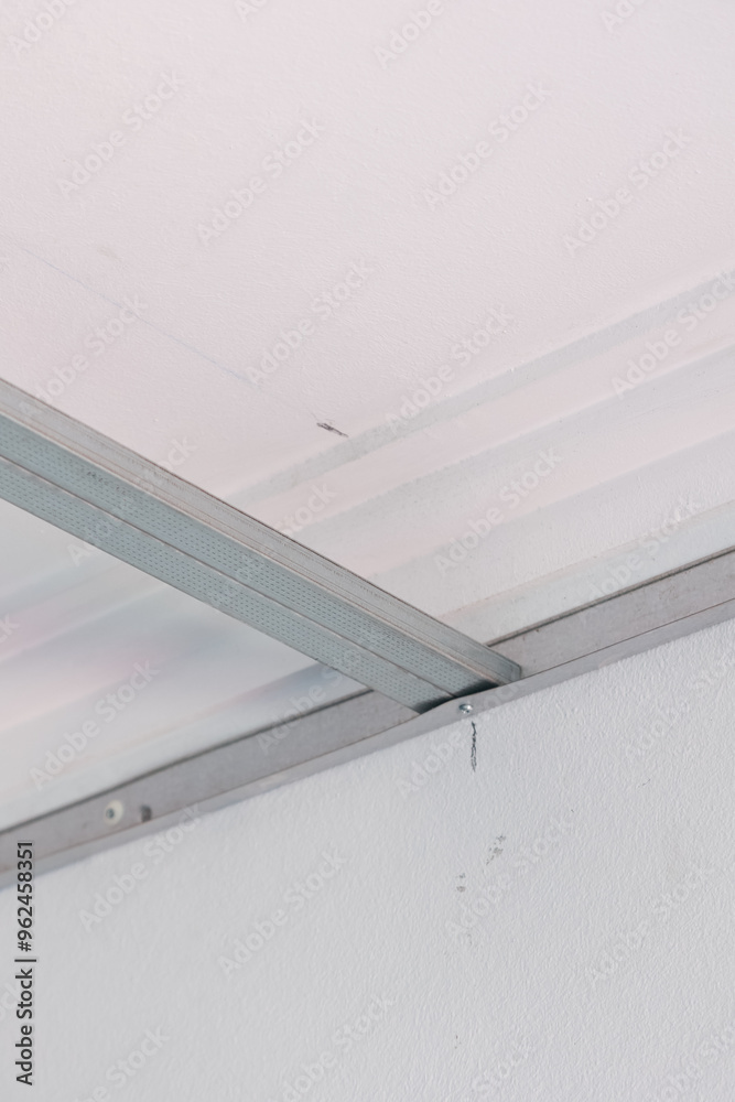 Close-up of a suspended ceiling installation with visible metal ...