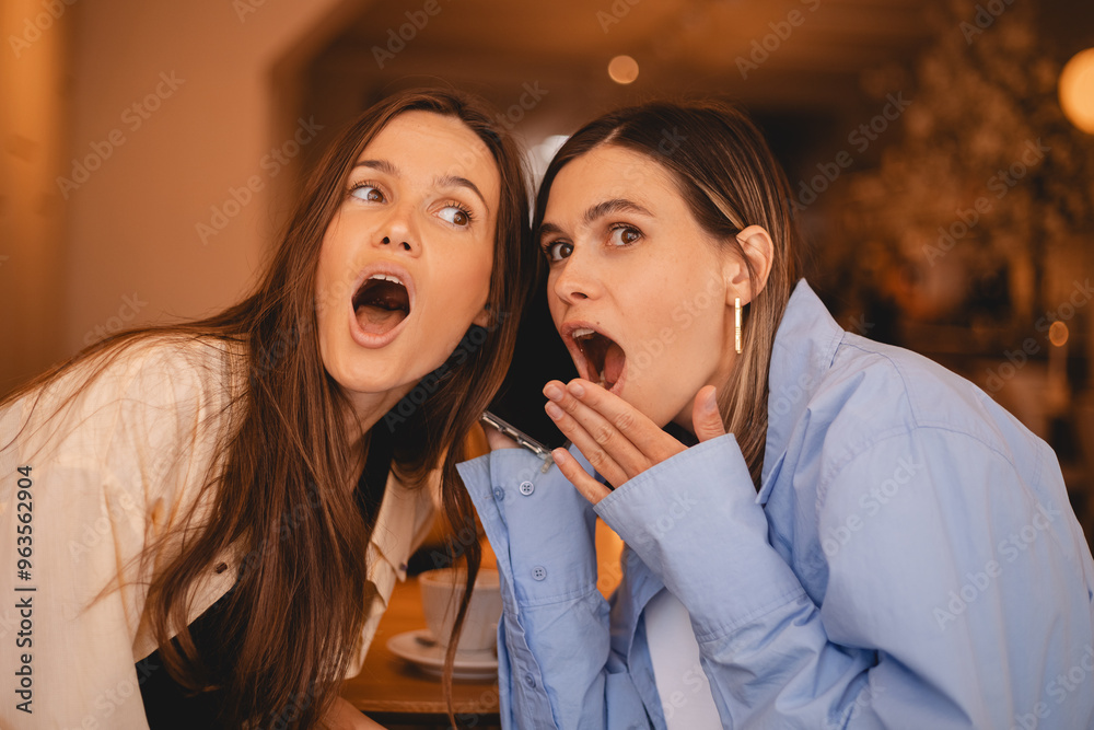 Shocked beautiful young woman overhearing conversation of cheerful ...