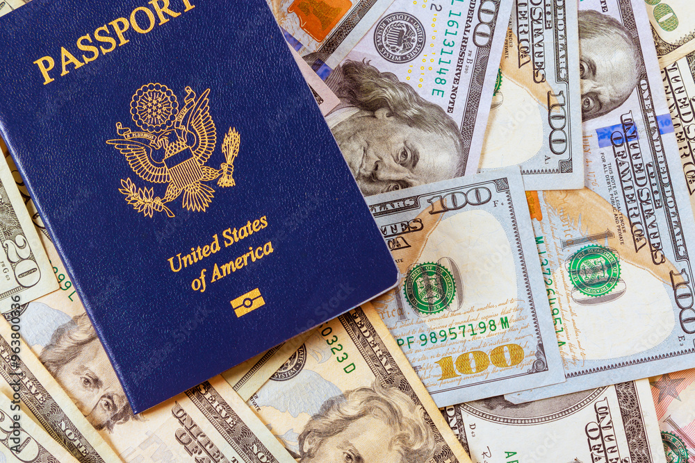 American passports on top US currency American dollar cash banknotes different nominal obrazy fototapety plakaty BajeczneObrazy.pl