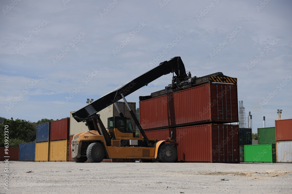Reach stacker crane lifting container for Industrial work at container ...