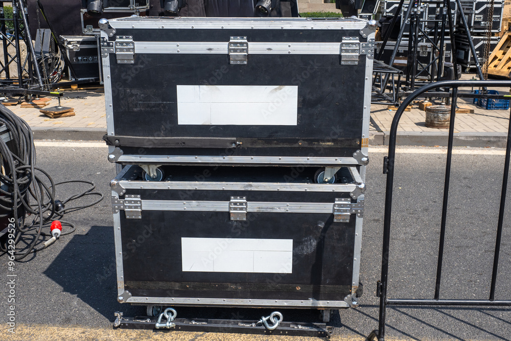 Cases for musical equipment on square. Preparation for festival. Sound ...