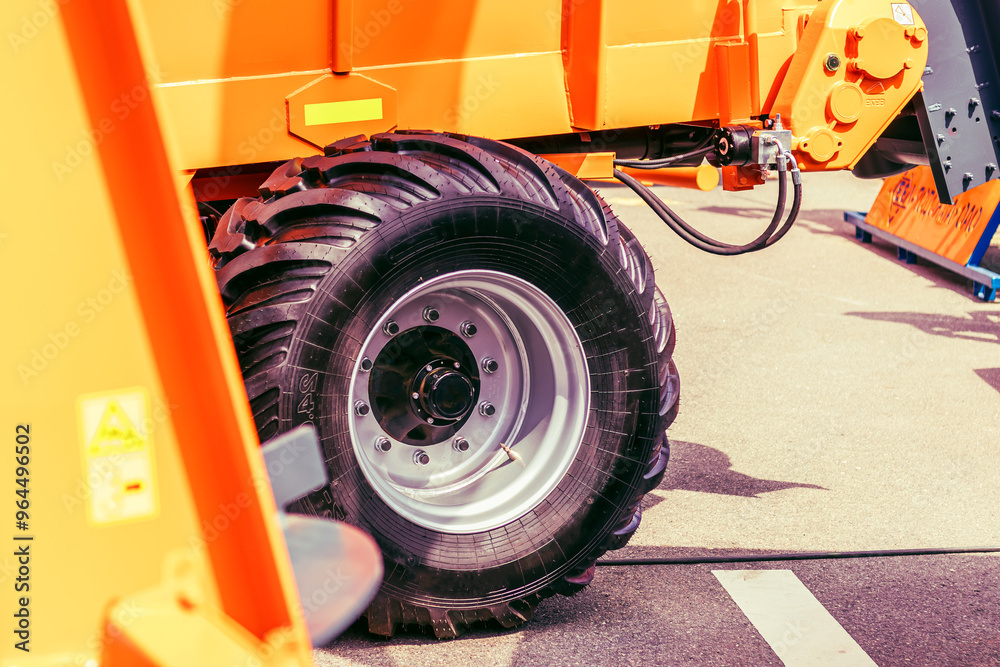Dump truck wheels with all-season tires on an asphalt road. Close-up of ...