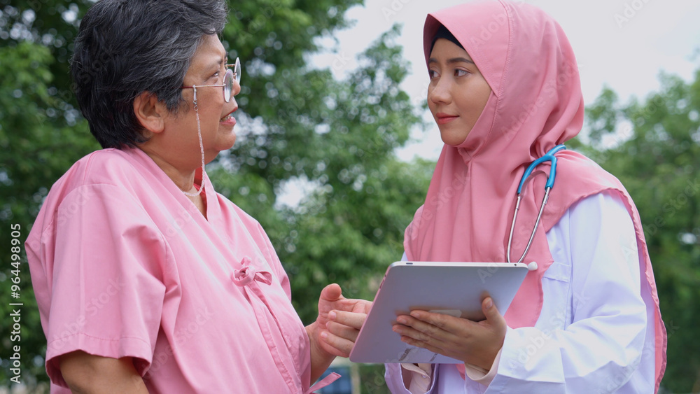 Muslim careful caregivers or doctors hold the tablet to Explain ...