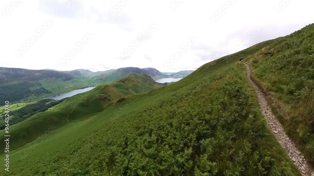 First person POV footage walking along footpath trail along a remote ...