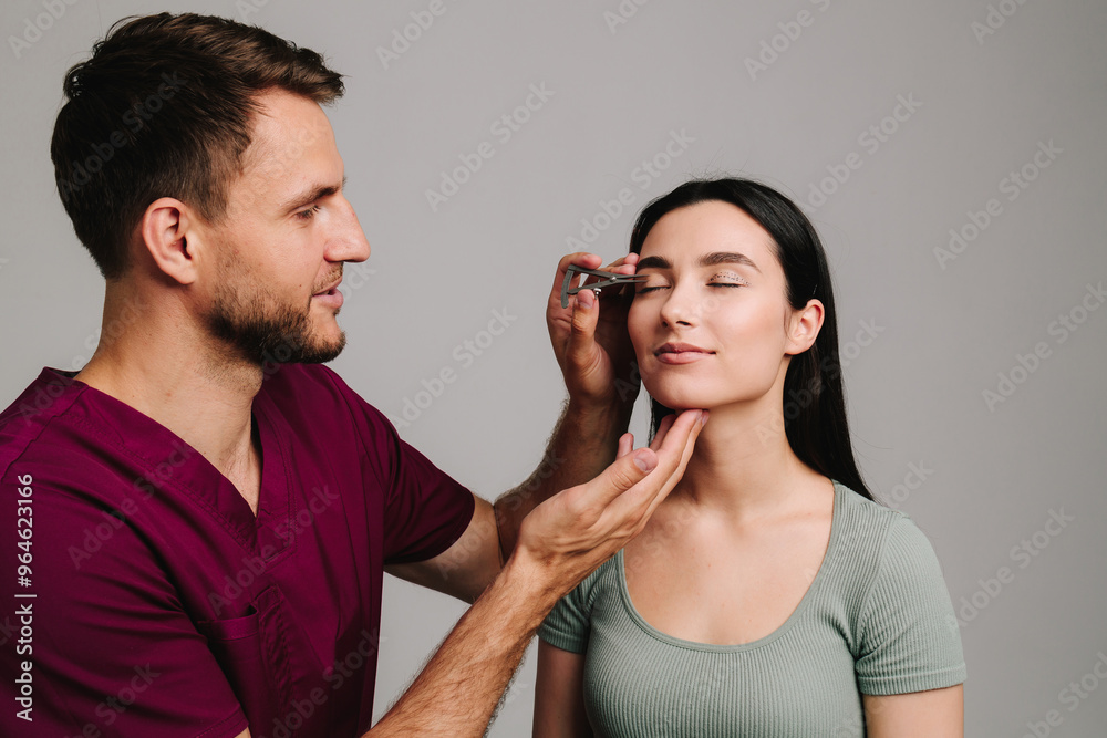 Castroviejo caliper to draw symmetrical contour for eyelid surgery ...